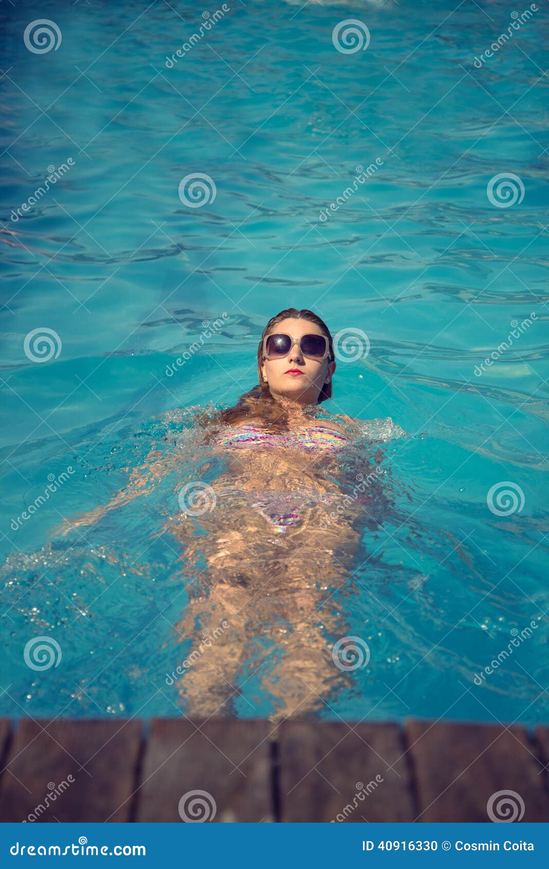 Beautiful Sexy Woman Swimming Backside In A Perfect Blue Water Wearing