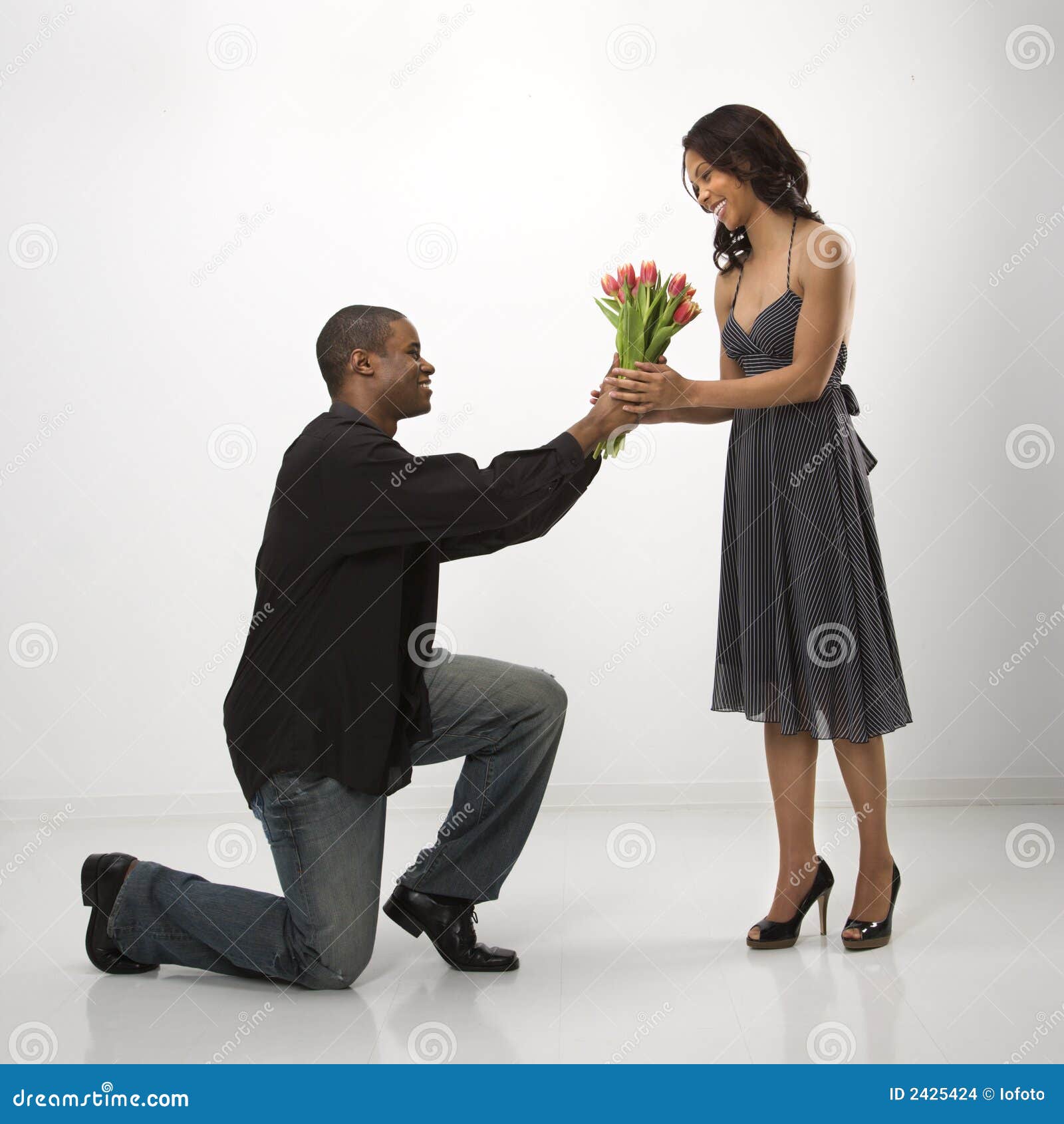 Man Giving Woman Flowers. Stock Images - Image: 2425424 Man Giving Woman Flowers. Stock Images - Image: 2425424
