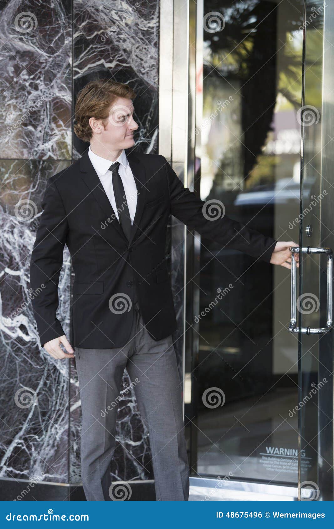 Man In Suit Opens A Door Stock Photo - Image: 48675496 Man In Suit Opens A Door Stock Photo - Image: 48675496