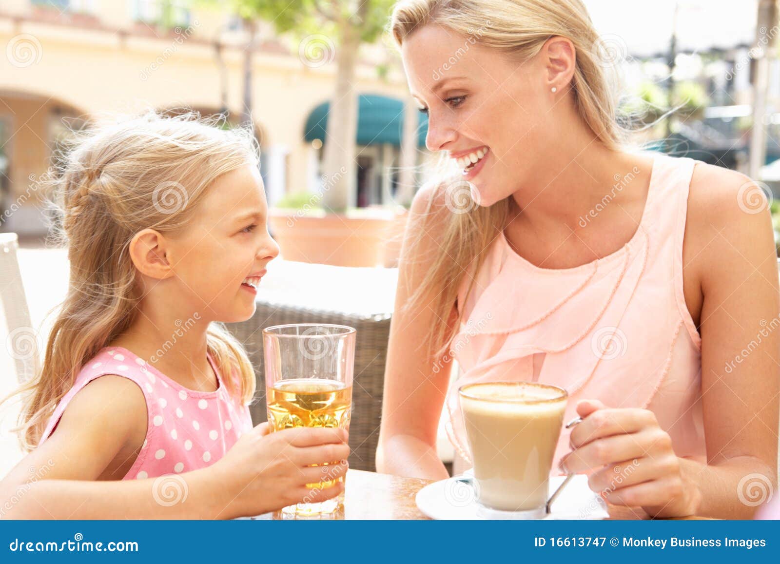 Mother And Daughter Enjoying Cup Of Coffee Royalty Free Stock