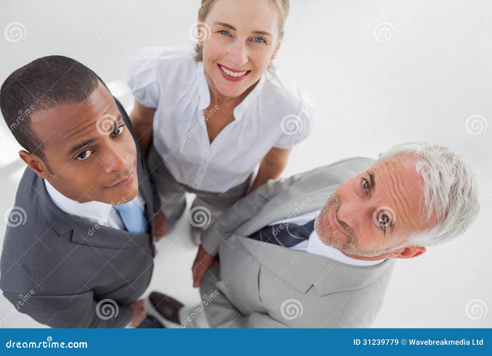 Overview Of Three Business People Standing Close To Each Other Royalty ... Overview Of Three Business People Standing Close To Each Other Royalty ...