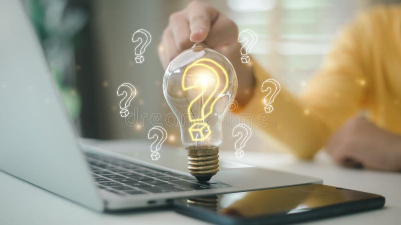 Hand Touching the Light Bulb with the Question Mark Inside. Concept of ...