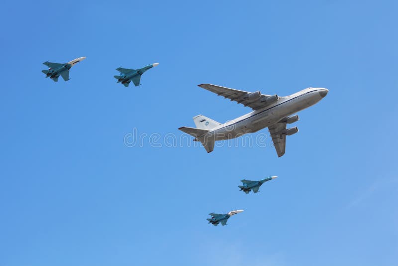 An-124 Plane Accompanied by Group of Su-27 Fighter Editorial ...