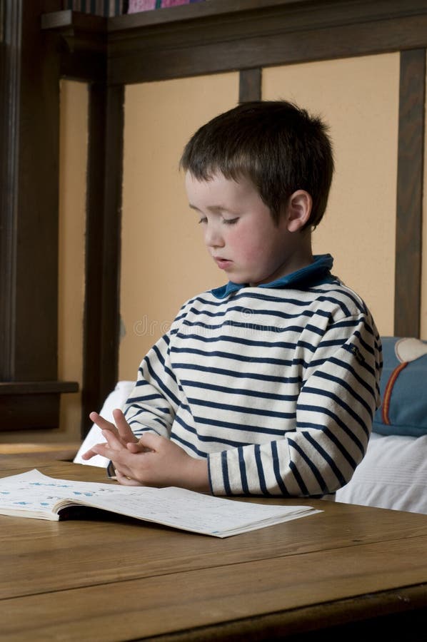 1st Grade Boy Doing Homework Stock Photo - Image of practice, fingers ...