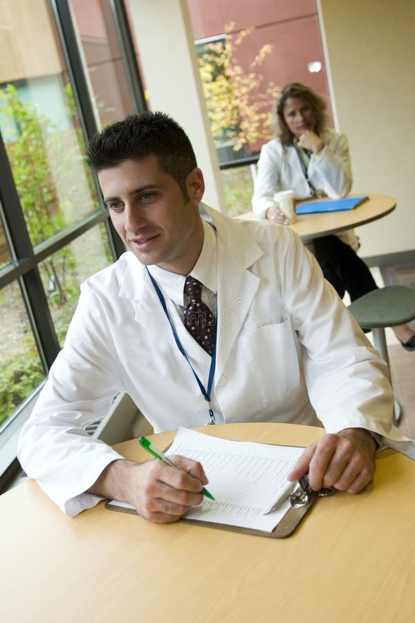 2 Doctors Outside of Hospital ER Stock Photo - Image of nurse, male ...