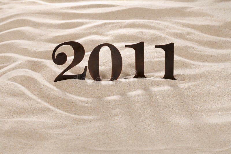 2011 Metal Numbers on Beach Sand Stock Photo - Image of metal, number ...