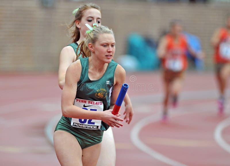 2012 Track - Female HS Relay Runner Editorial Photo - Image of teamwork ...