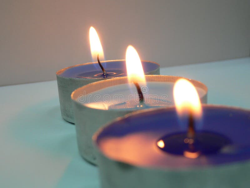 3 candles in a row stock photo. Image of flicker, colours - 103546