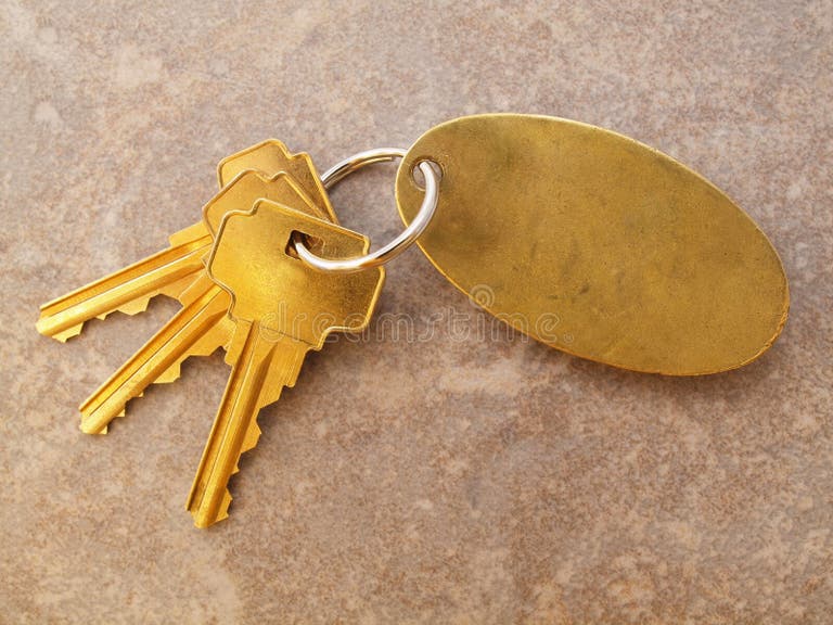 3 Gold Keys and Blank Keychain on Tile Stock Image - Image of open ...