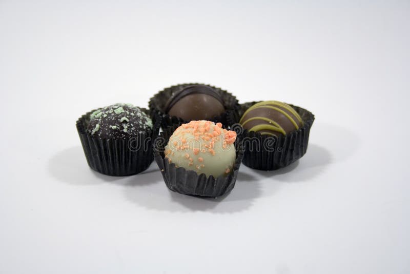 4 Chocolates on White Background Stock Image - Image of white, dark ...