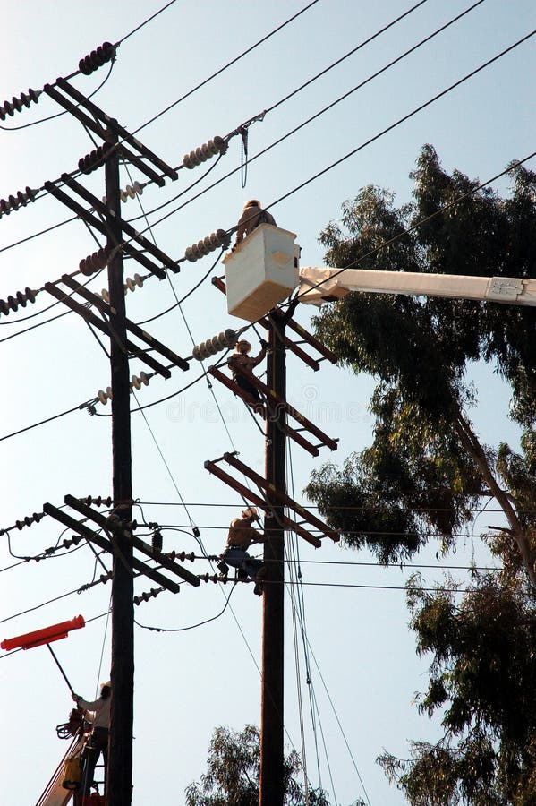 4 men working on pole stock photo. Image of distribution - 219178