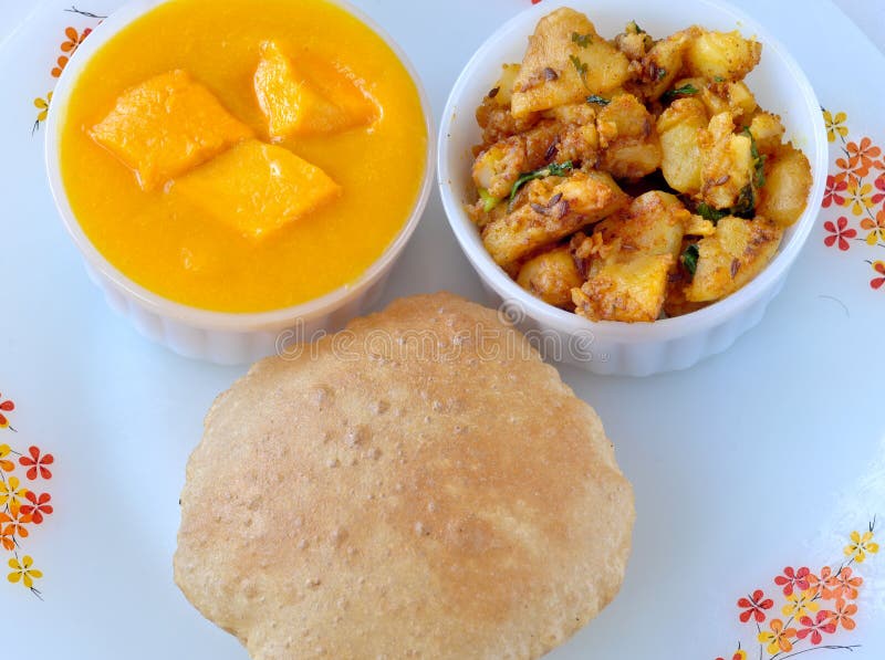Aam Ras with Puri Sabji stock image. Image of gourmet - 25355617