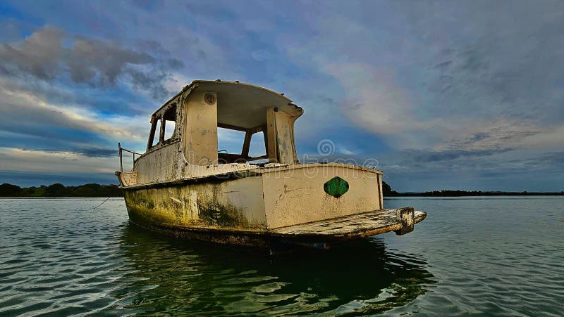 Abandoned Boat Calm Waters Dramatic Sky Stock Photos - Free & Royalty ...