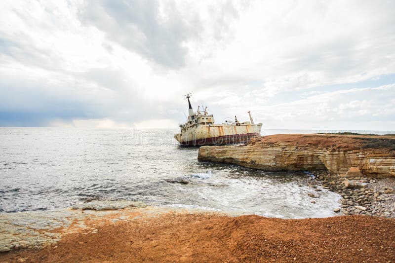 Abandoned Broken Ship-wreck Beached on Rocky Sea Shore. Stock Image ...