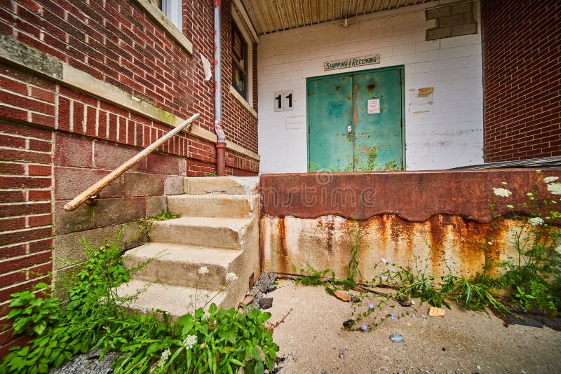 Abandoned Building Back Shipping Receiving Entrance with Brick, Rust ...