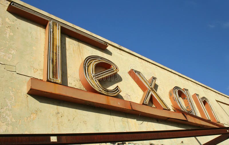 Abandoned Building Sign Texan and Blue Sky Background Stock Image ...