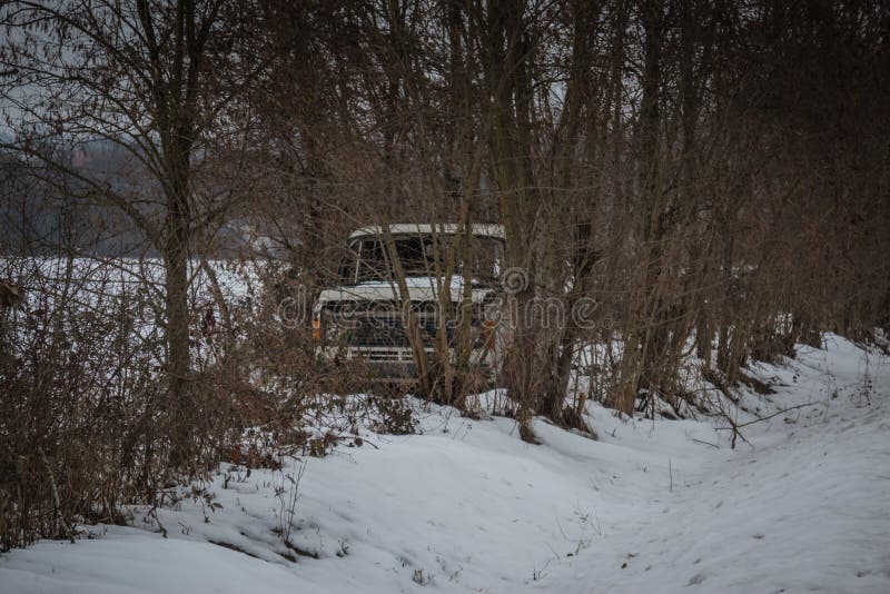 Abandoned Car, Van Surrounded with Snow and Shrubs in Winter Time Stock ...