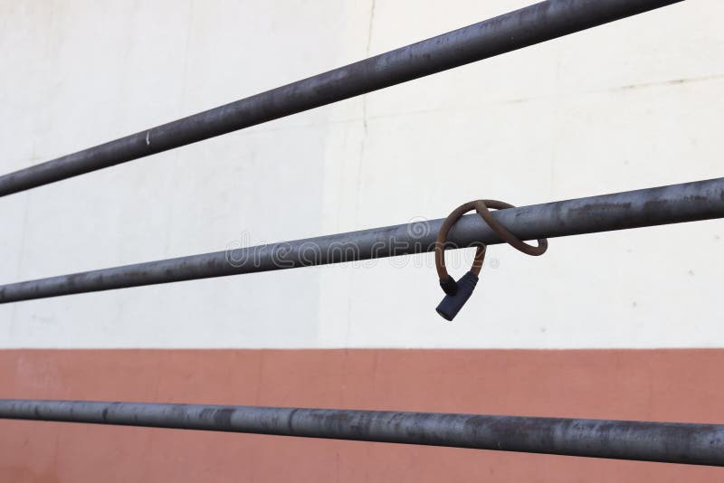 Abandoned and Closed Bicycle Key Lock on the Handrail of a Fence Stock ...