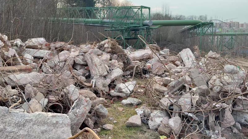 An Abandoned Construction Site Filled with Debris, Overgrowth, and ...