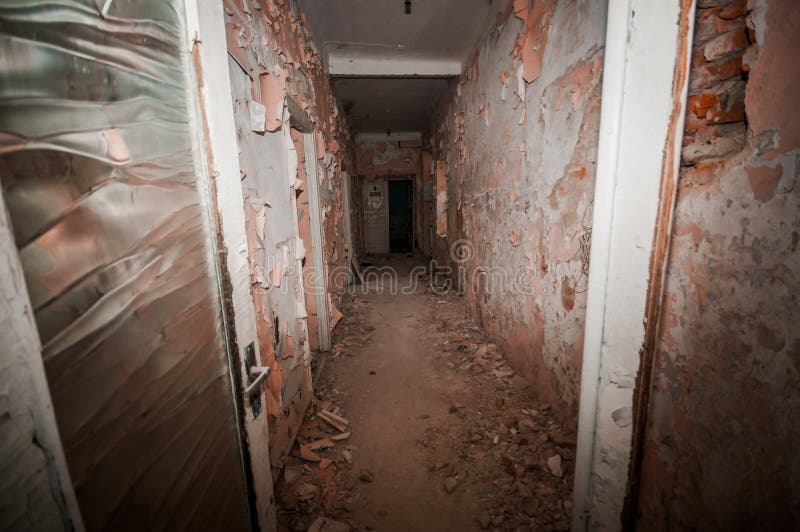 Abandoned Corridor of Decay Featuring Flaking Walls and Layers of Dust ...