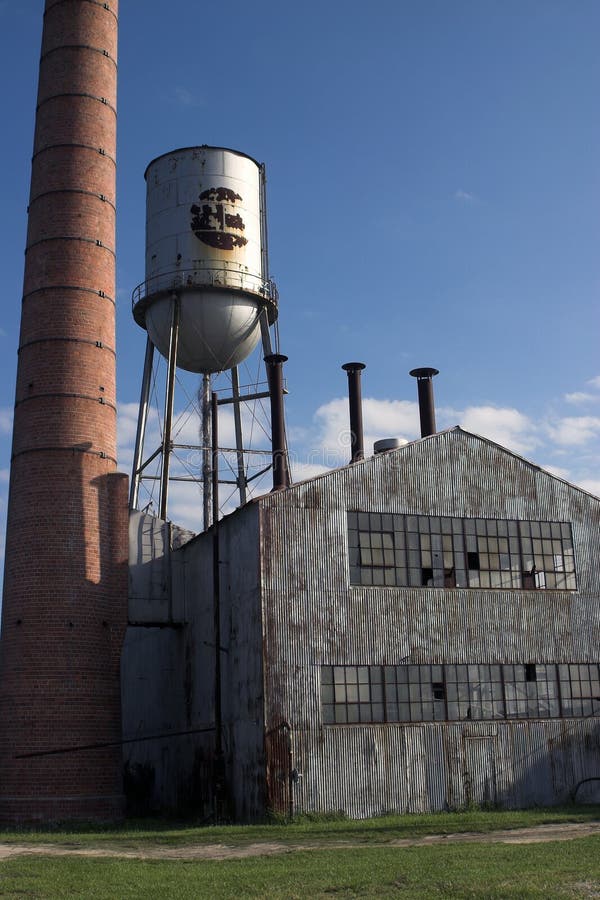 Abandoned Factory Building with Water Tower and Chimney Stock Photo ...