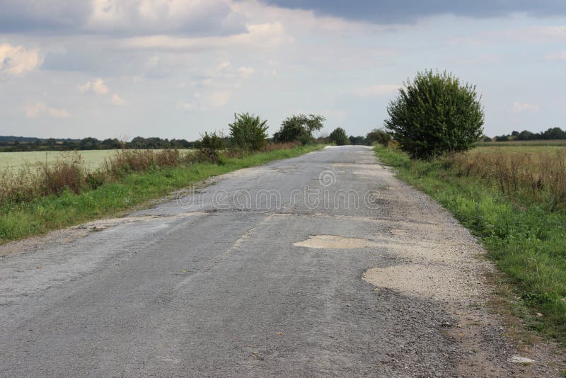 Abandoned Field Road Covered with Destroyed Asphalt Pavement Stock ...