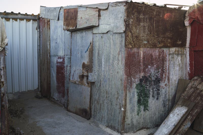 Abandoned Garage Covered with Old Rusty Tin Sheets and Slate Stock ...