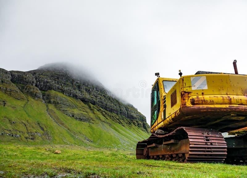 Abandoned Heavy Machine in the Hillside Under White Sky Stock Photo ...