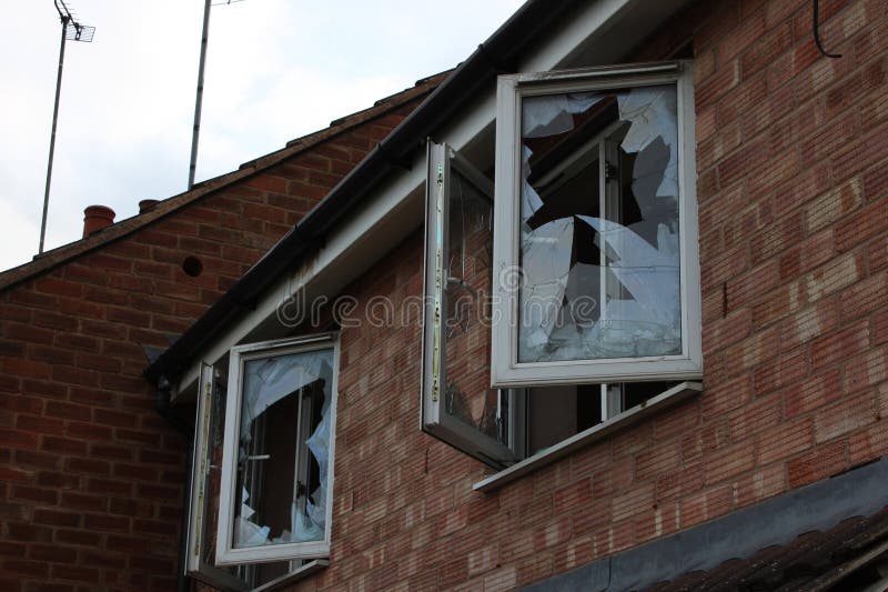 Abandoned House with Two Open Smashed Windows UK Stock Photo - Image of ...