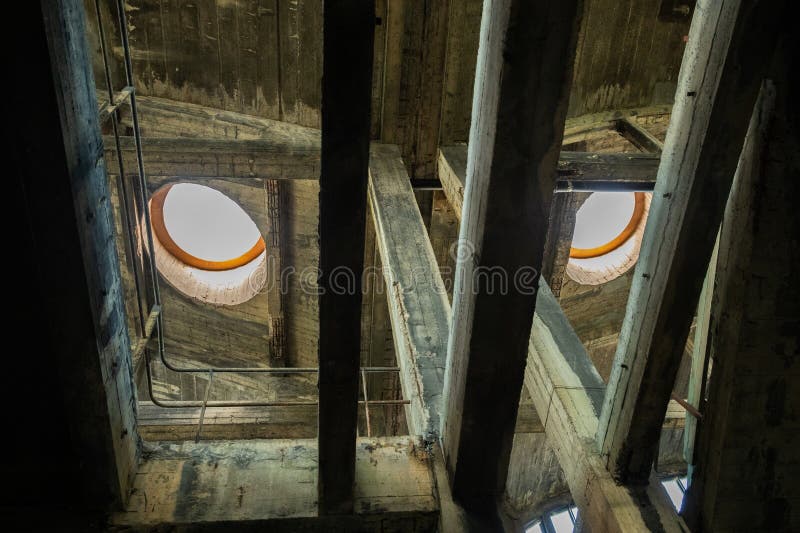 Abandoned Industrial Ceiling with Exposed Concrete Beams and Circular ...