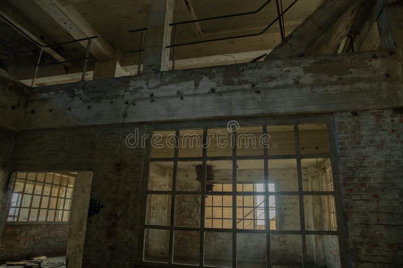 Abandoned Industrial Interior with Broken Grid Windows and Exposed ...