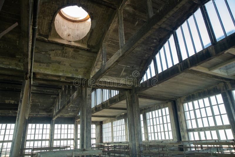 Abandoned Industrial Interior with Circular Skylight and Large Grid ...