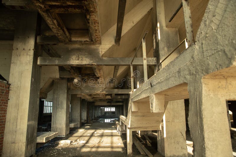 Abandoned Industrial Interior with Exposed Concrete Beams and Rusted ...