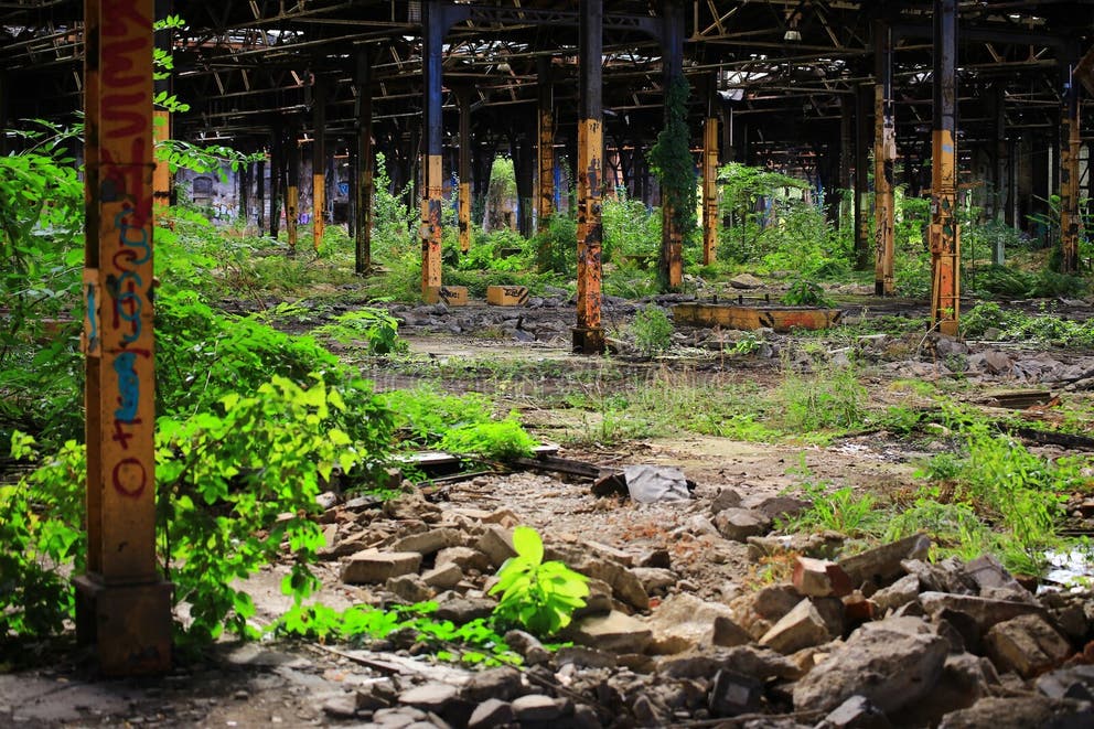 Abandoned Industrial Structure with Rusted Pillars Overrun by ...
