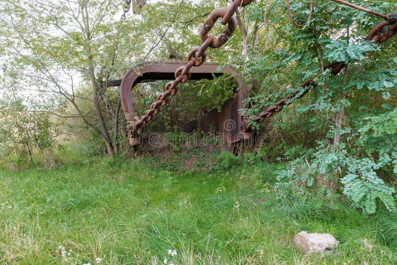 Abandoned Machinery Surrounded by Overgrown Vegetation Stock Photo ...