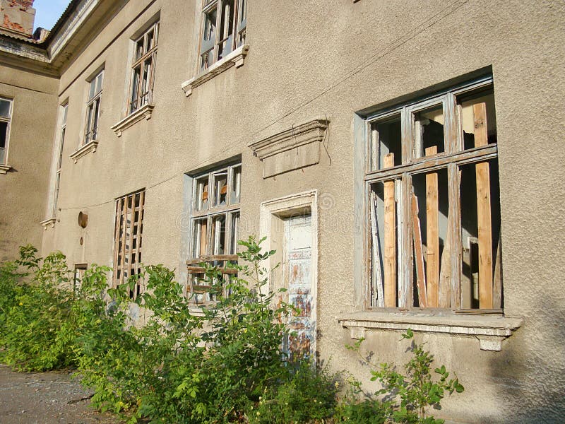 An Abandoned, Multi-storied Building with Deterioration Signs, Boarded ...