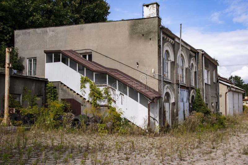 Abandoned and Neglected Building Under a Blue Sky on a Sunny Day ...