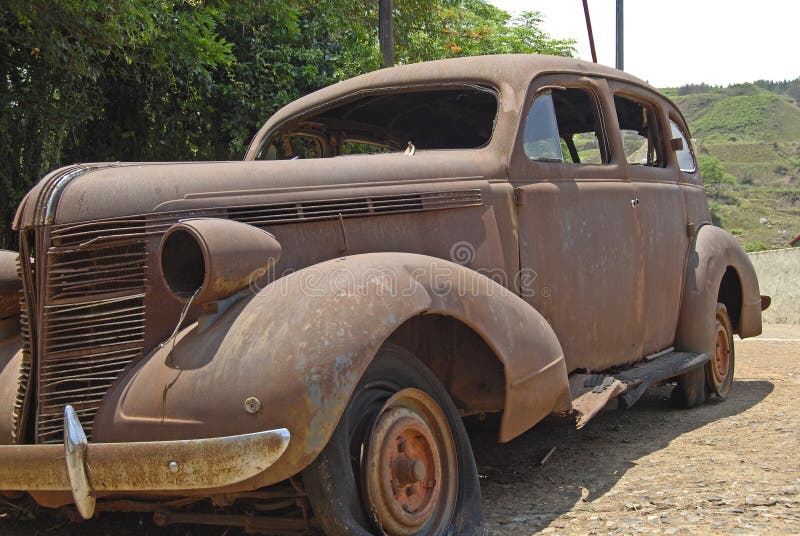Old Rusty and Damaged Antique Car Wreck in Very Poor Condition Stock ...