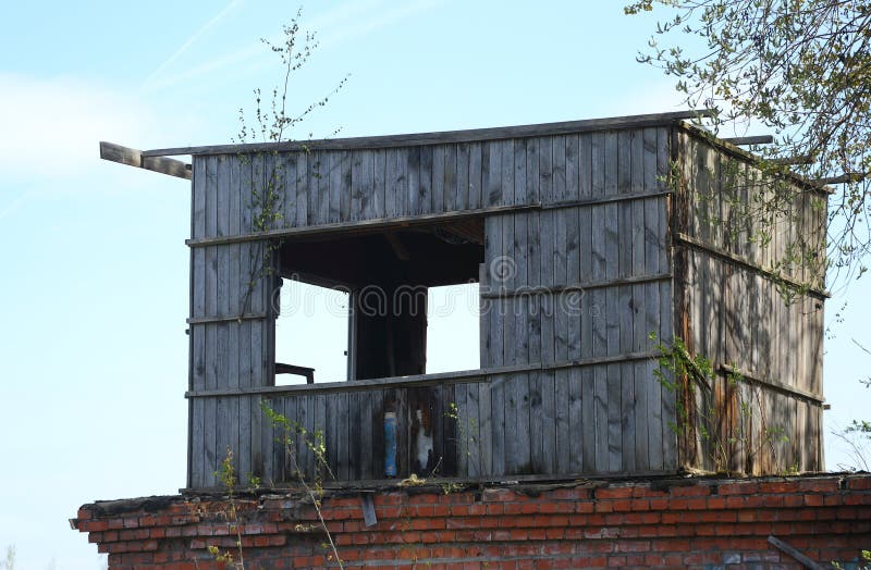 An Abandoned Old Wooden Guard Booth on a Brick Wall Stock Photo - Image ...