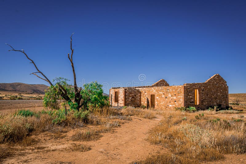 Abandoned Outback Building Amidst Harsh Landscape Stock Photo - Image ...