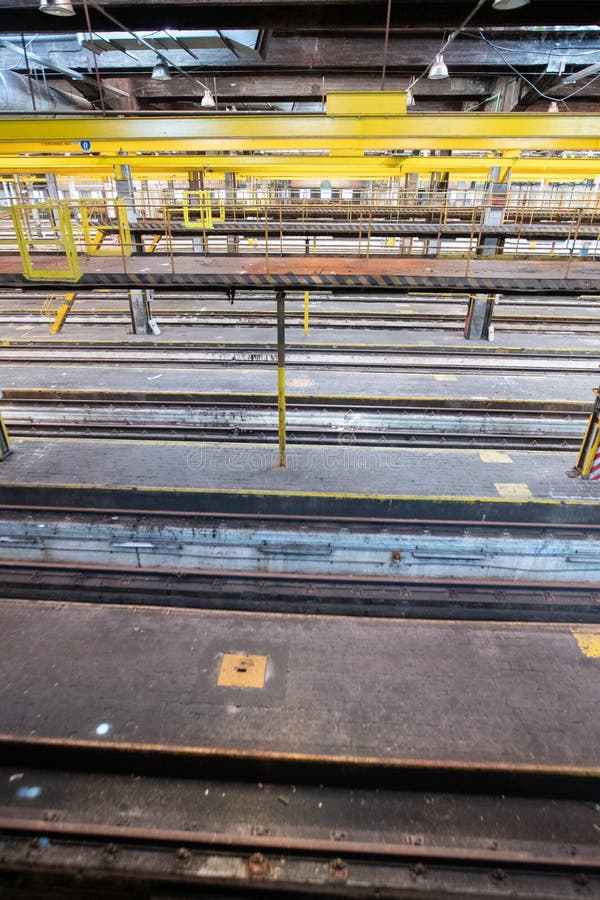 Abandoned Railway Depot with Elevated Yellow Platforms and Tracks Stock ...