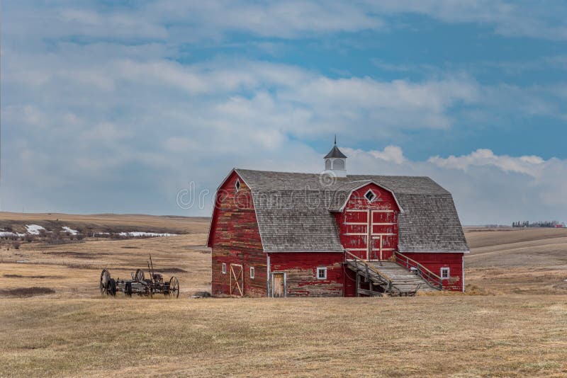 An Abandoned Red Barn with a Wagon Ramp on the Saskatchewan Prairies ...