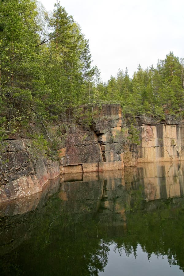 Abandoned Rock Quarry Filled with Water and Bare Walls. Stock Photo ...