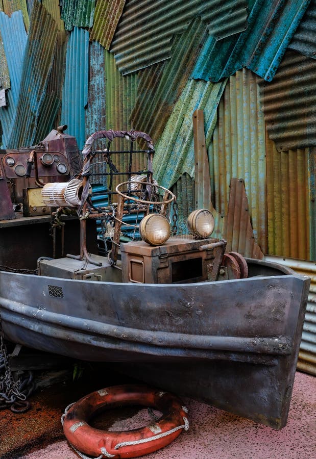 Abandoned Rusty Metal Ship Parked in Front of Vintage Wall Stock Image ...