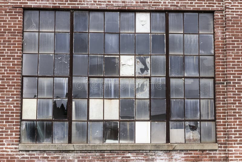Broken Windows and Worn Exterior of an Abandoned Coal Power Plant. Coal ...