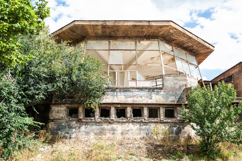Abandoned Soviet-era Building with Broken Windows and Overgrown ...