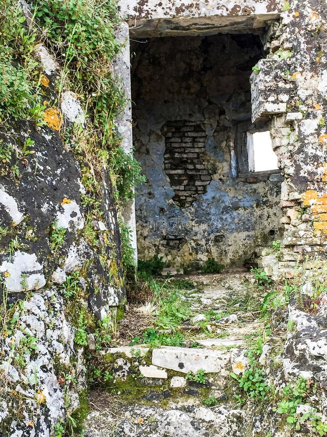 Abandoned Stone Structure with Exterior Covered in Foliage and Lichen ...