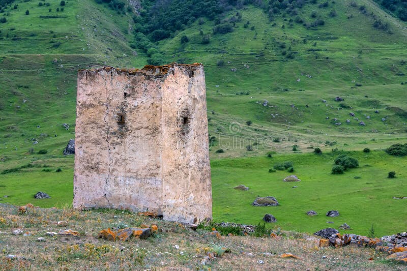 Abandoned Stone Tower on the Background of Green Mountains. Stock Image ...