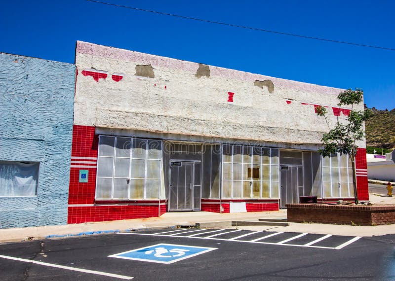 Abandoned Store Front Building with Wire Mesh Over Windows Stock Image ...