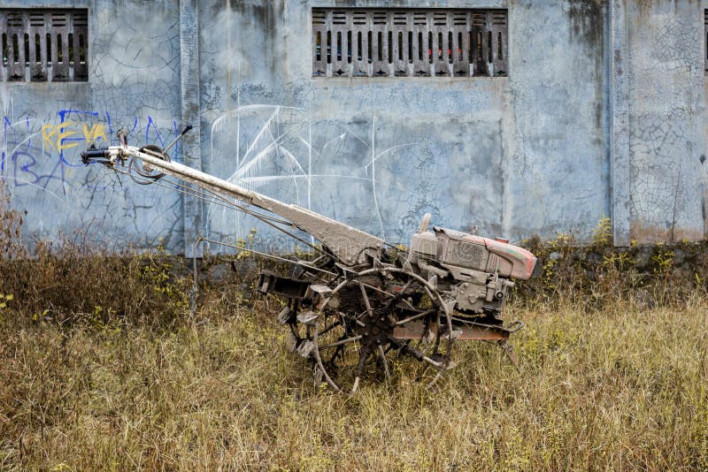 Abandoned Tractors in Rice Field Covered in Dry Mud. Stock Photo ...